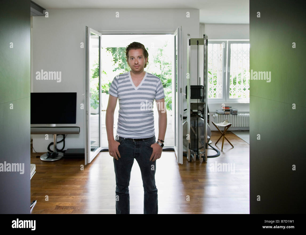 Portrait of a man in a living room Stock Photo - Alamy