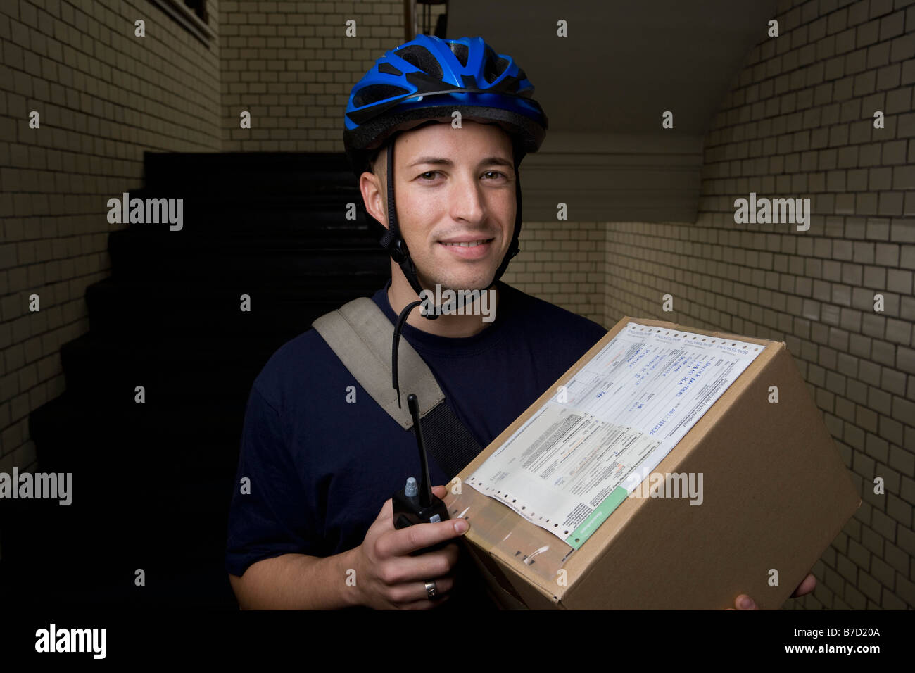 A bicycle messenger delivering a package Stock Photo - Alamy A bicycle messenger delivering a package Stock Photo - Alamy