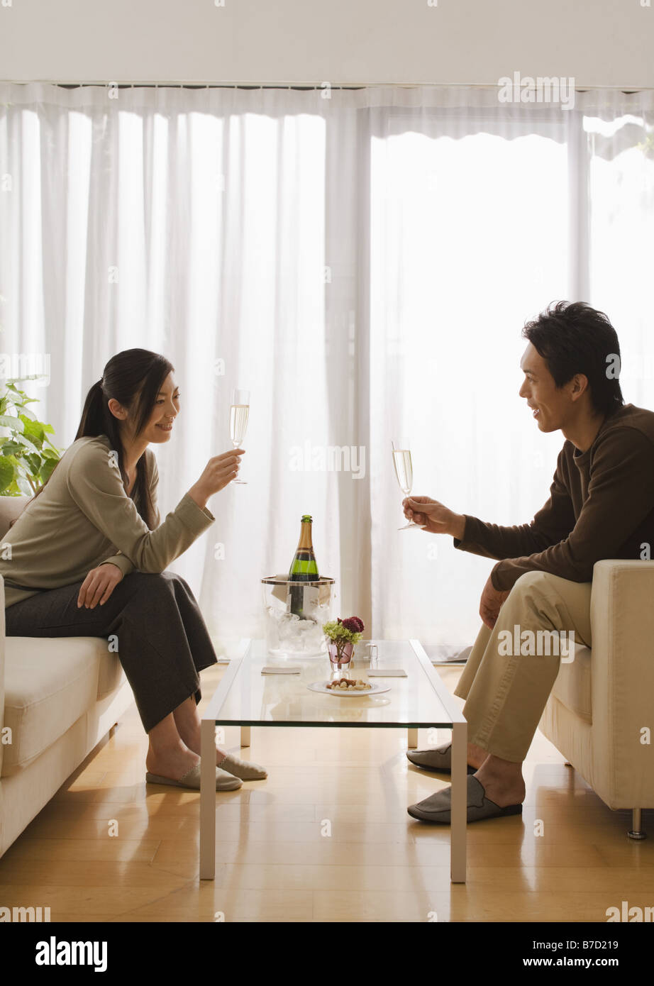 Couple drinking champagne Stock Photo - Alamy