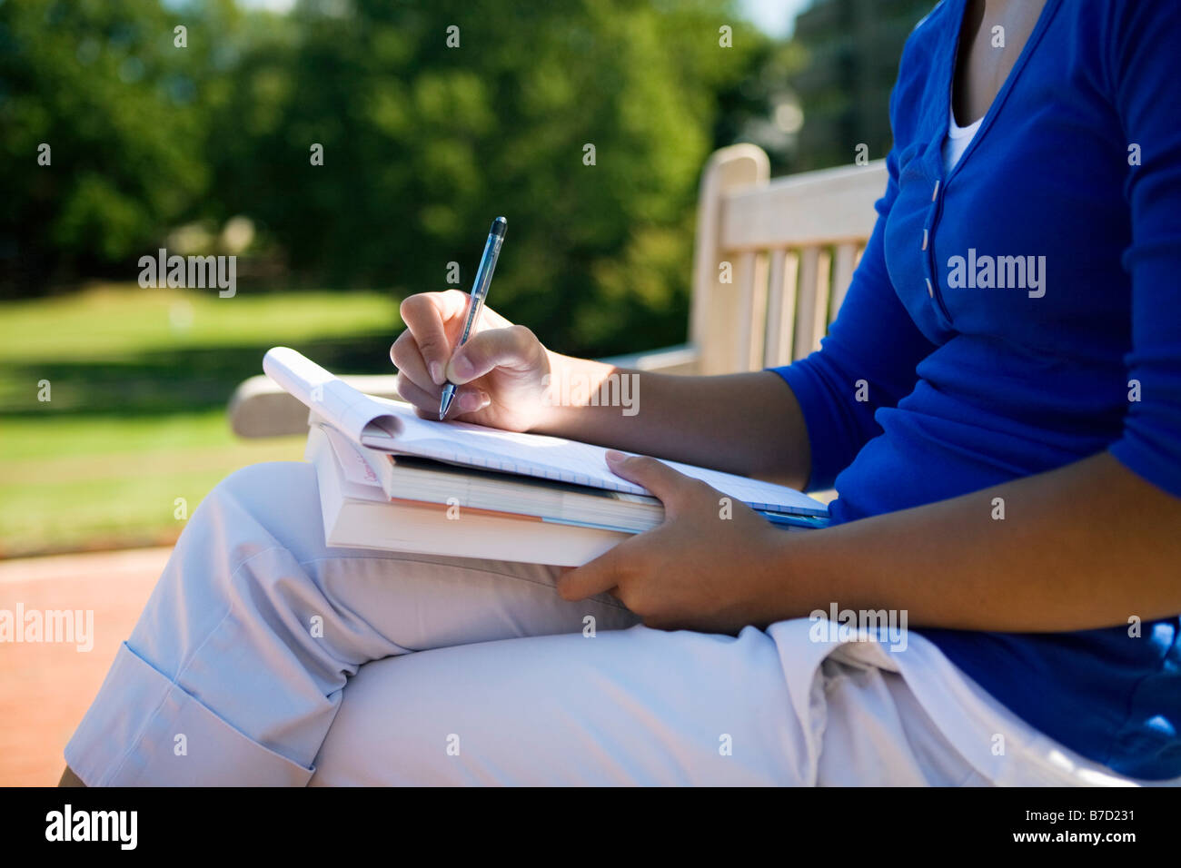 Detail of a young woman writing Stock Photo - Alamy
