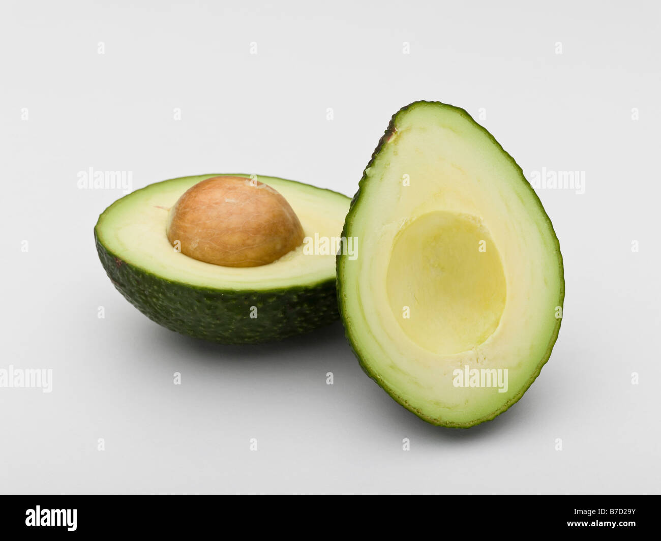 An avocado cut in half Stock Photo - Alamy