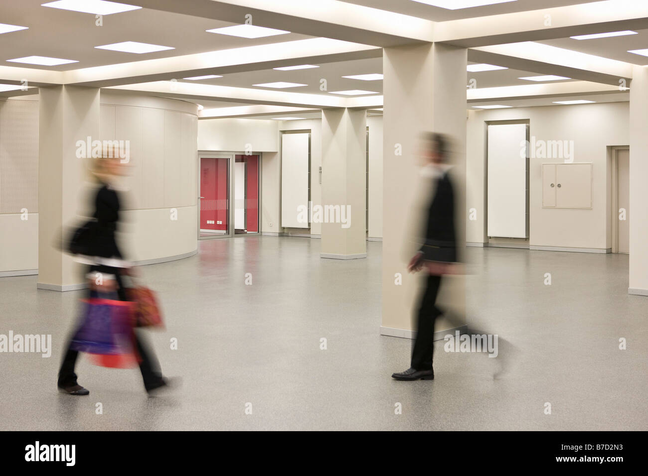 Two people rushing past each other Stock Photo - Alamy