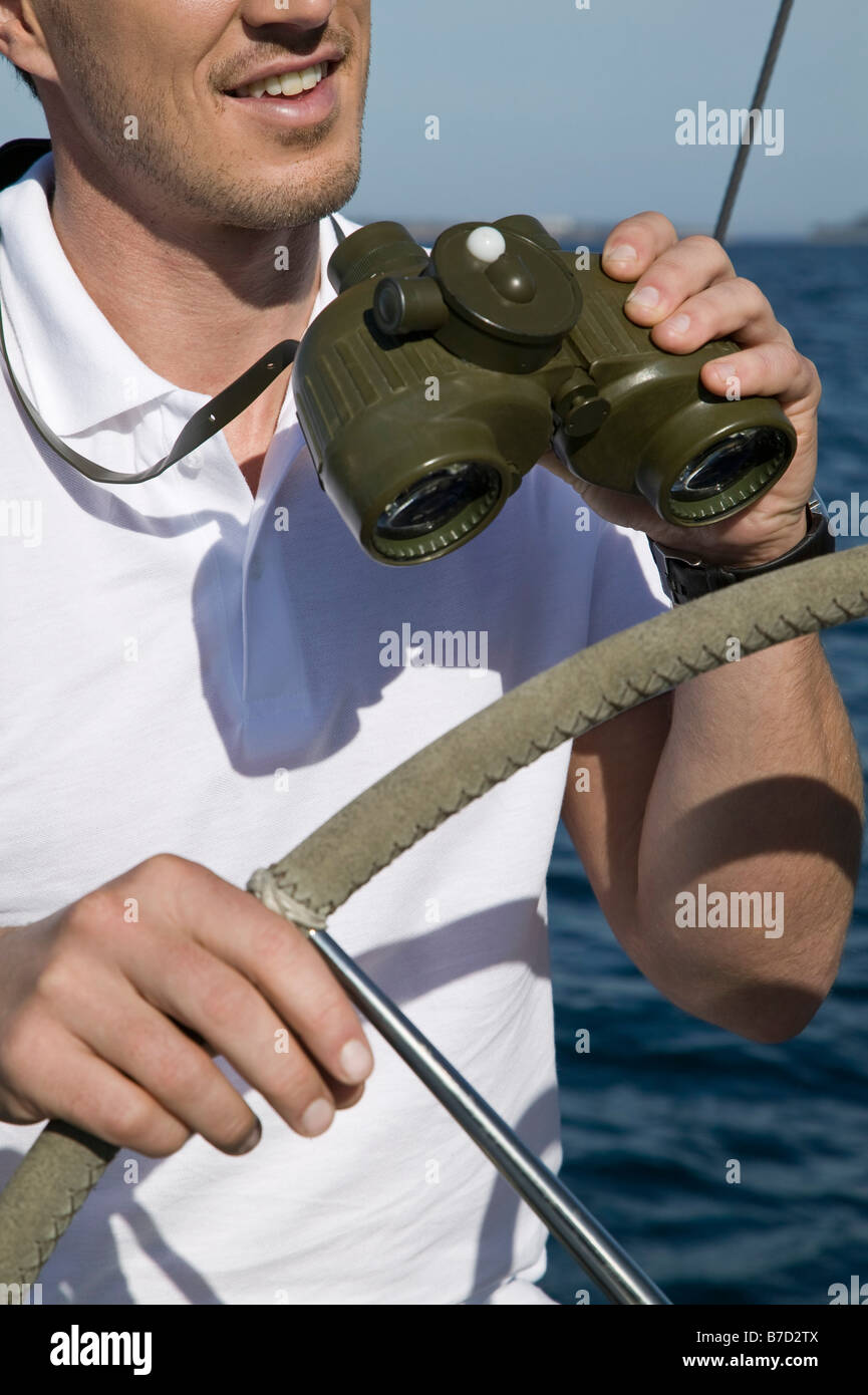 Man at helm hi-res stock photography and images - Alamy