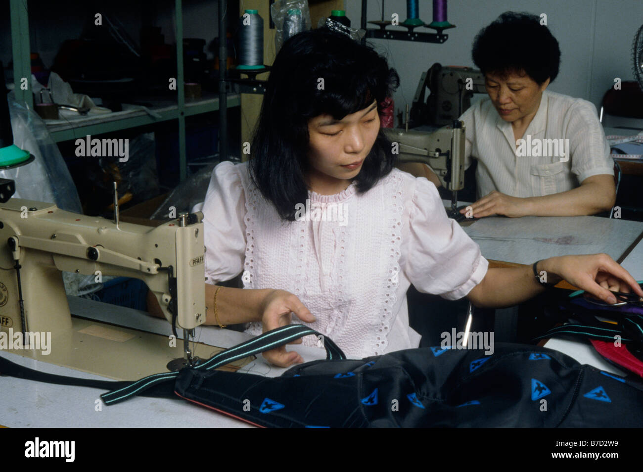 Chinese women working in garment factory HK ISLAND HONG KONG Stock ...