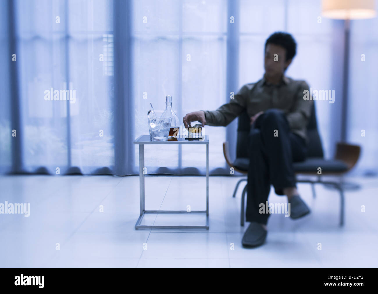 Man enjoying drinking brandy Stock Photo - Alamy