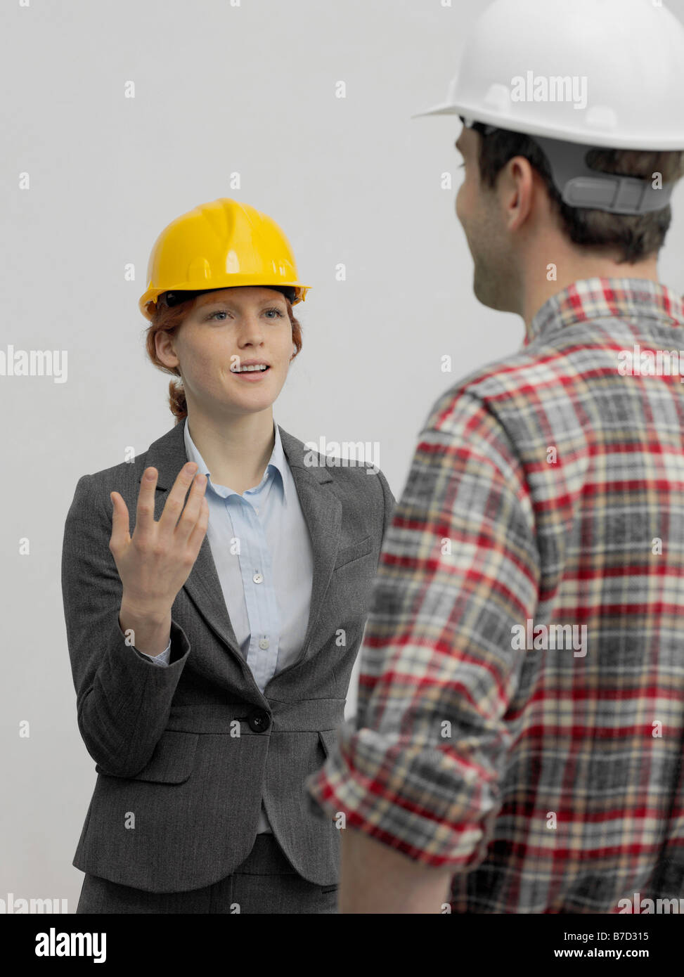 An architect speaking with a construction worker Stock Photo - Alamy