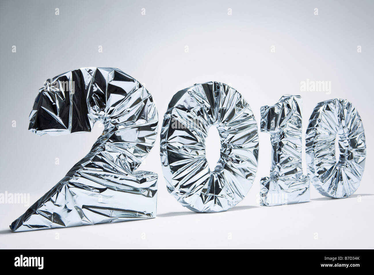 Number 2010 wrapped in silver paper Stock Photo - Alamy