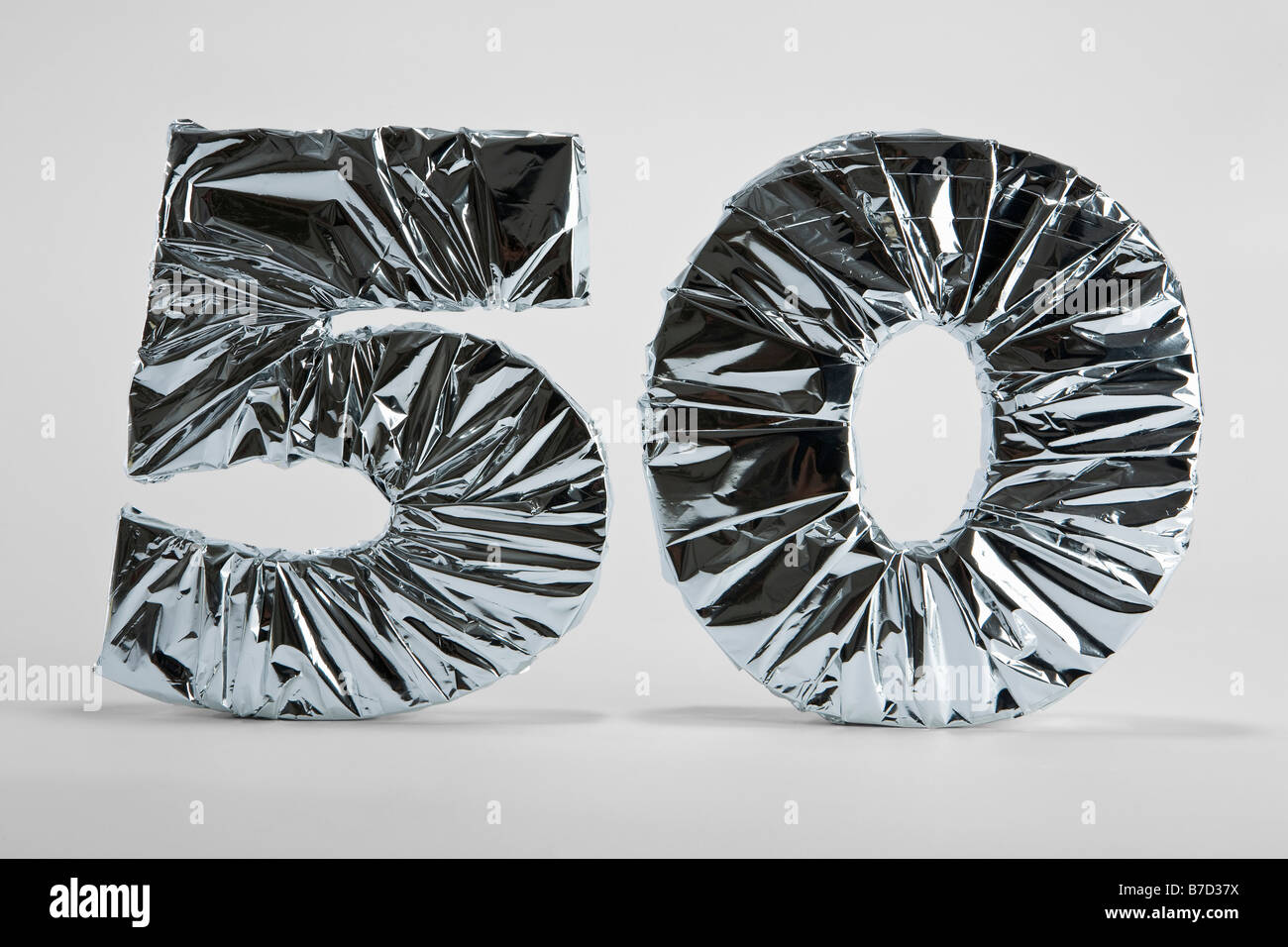 Number 50 wrapped in silver foil Stock Photo - Alamy