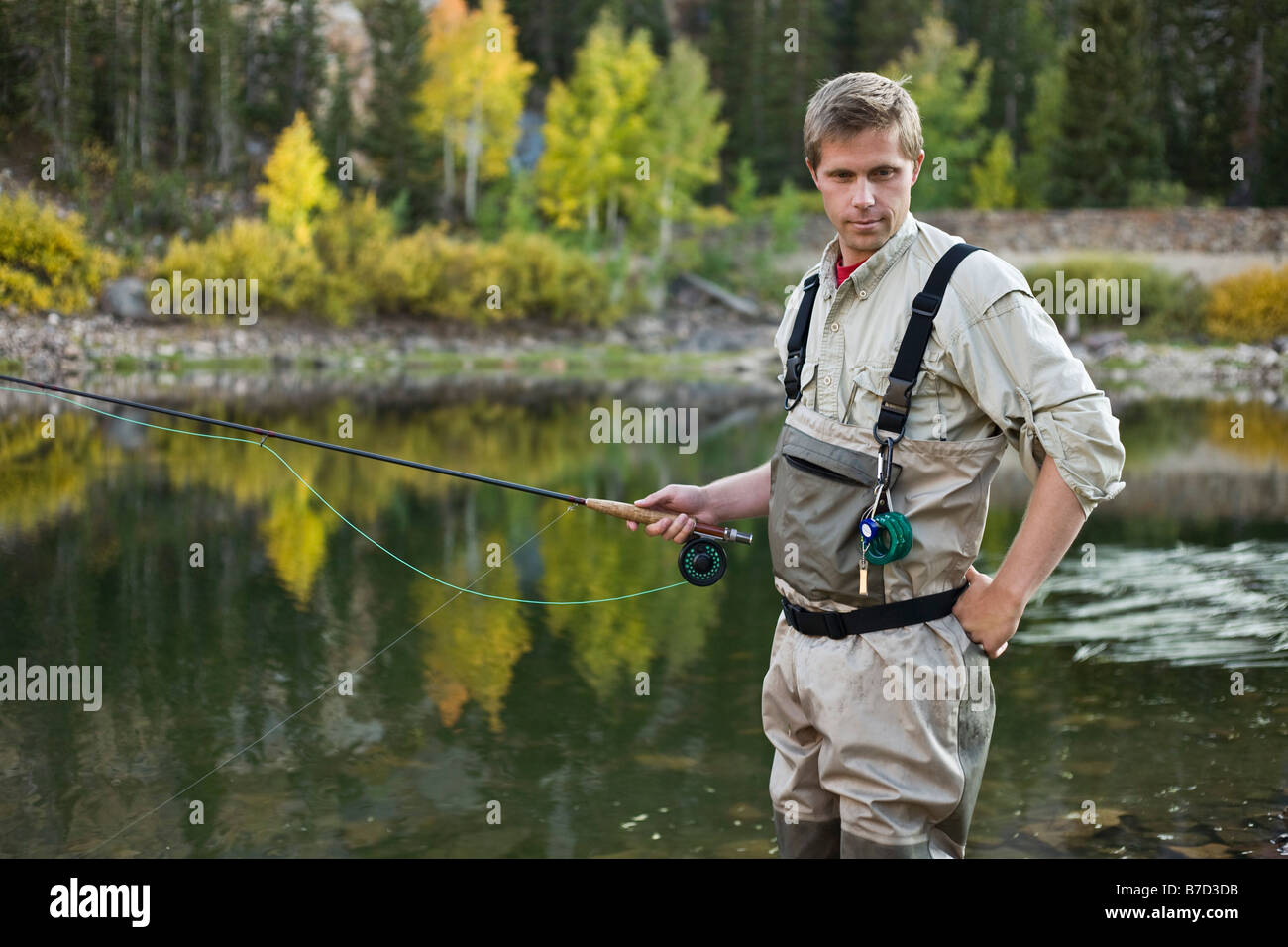 A man fly fishing Stock Photo - Alamy