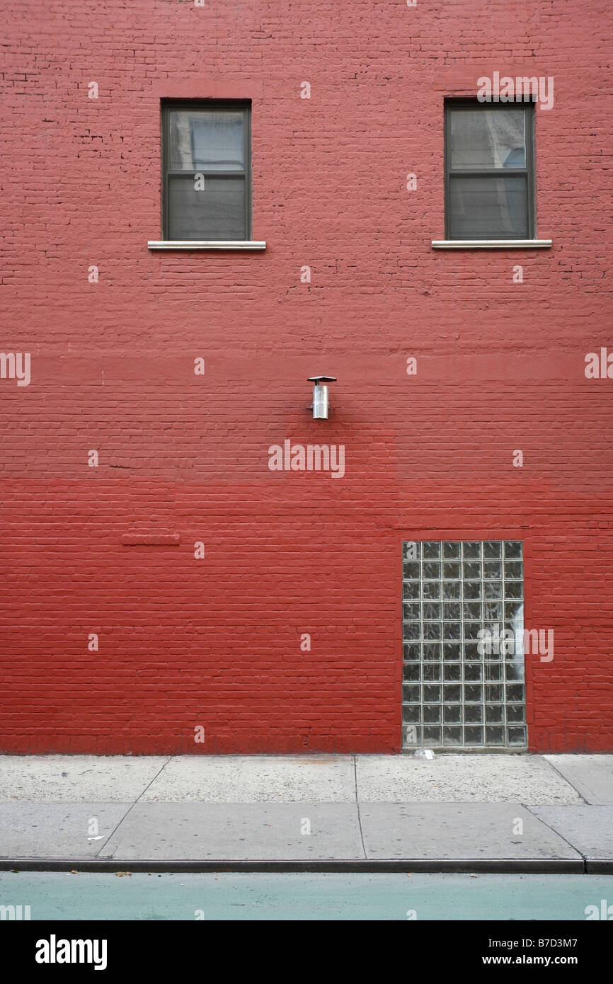 A brick building painted red Stock Photo - Alamy
