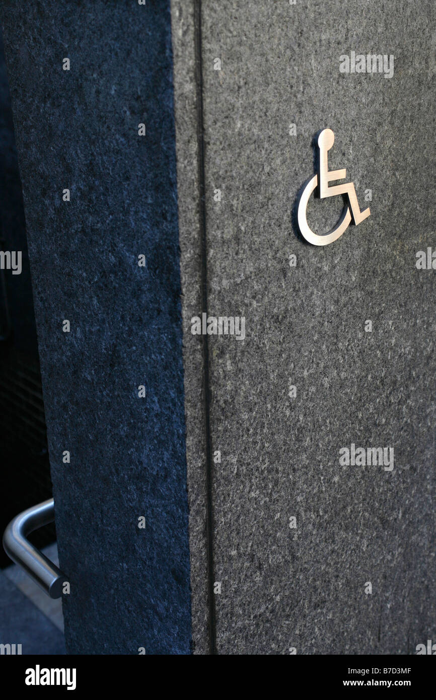 A disabled symbol on a wall Stock Photo - Alamy