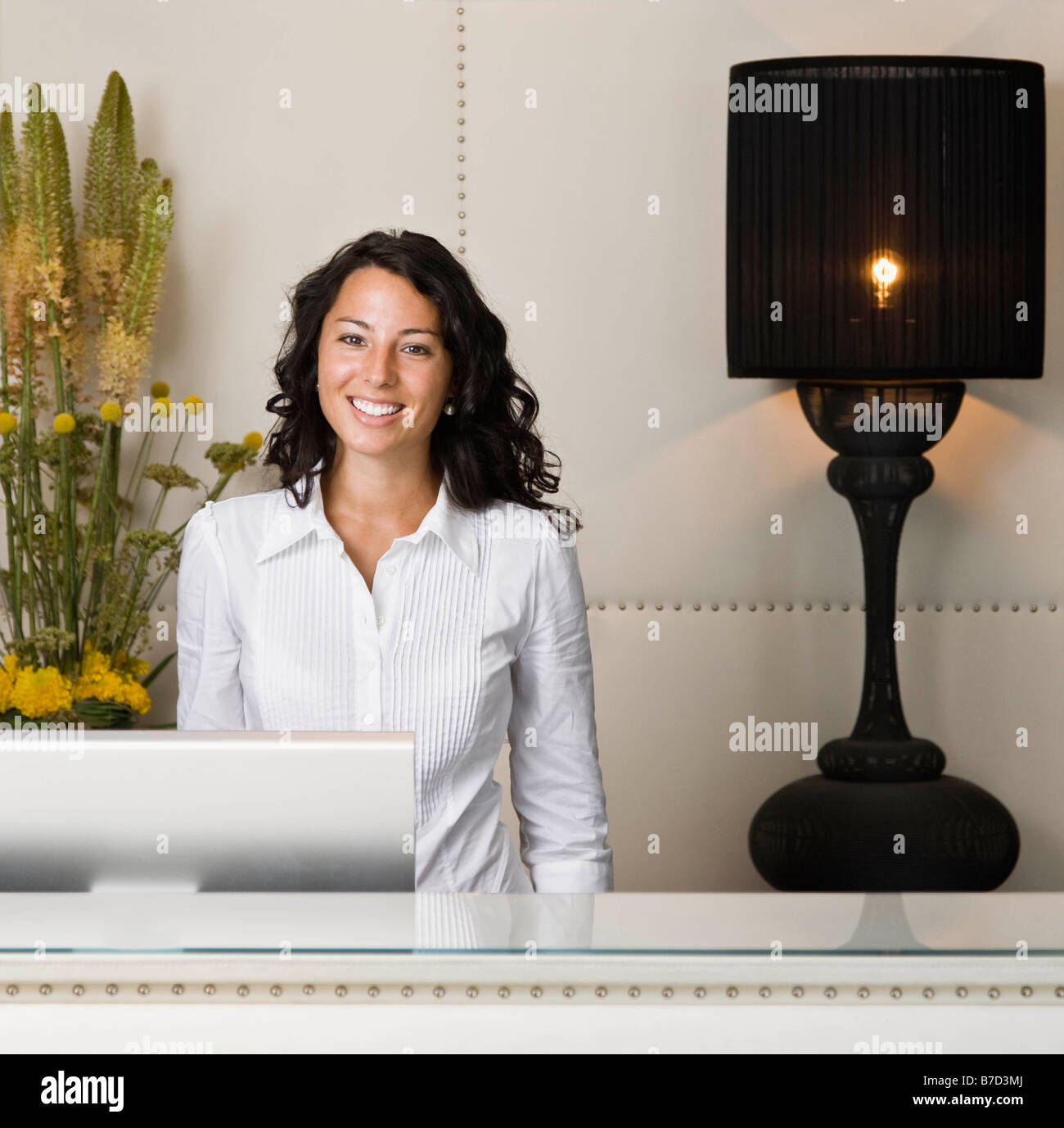 Portrait of a female receptionist Stock Photo - Alamy