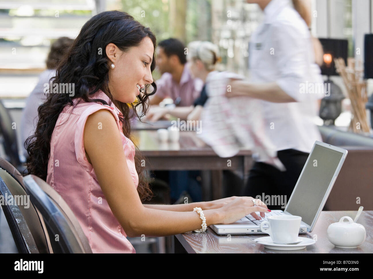 Woman working on laptop computer Stock Photo - Alamy