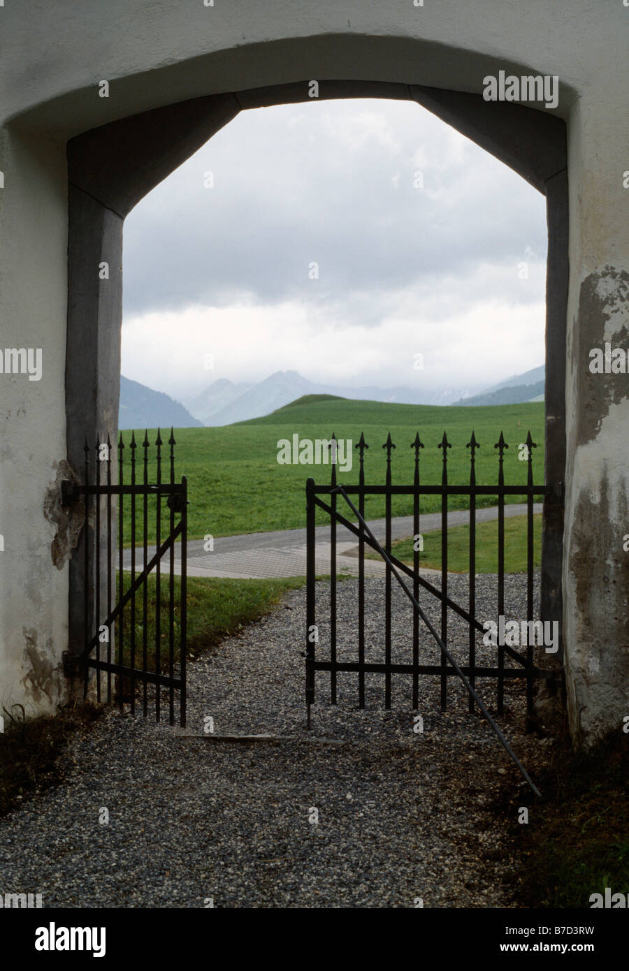 View through a gate of mountain ranges Stock Photo - Alamy