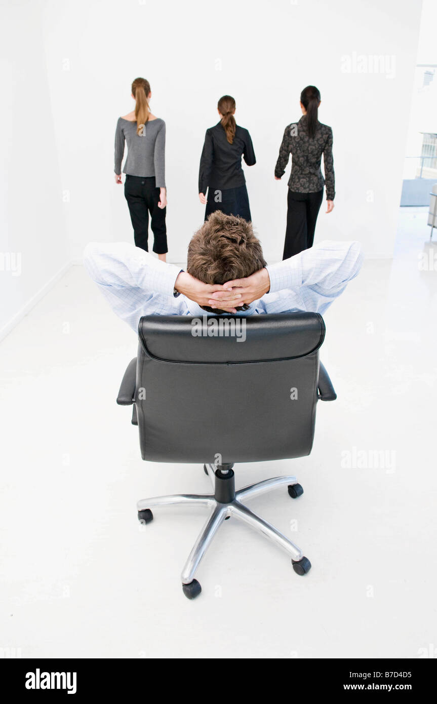 A business man reclining in chair Stock Photo - Alamy