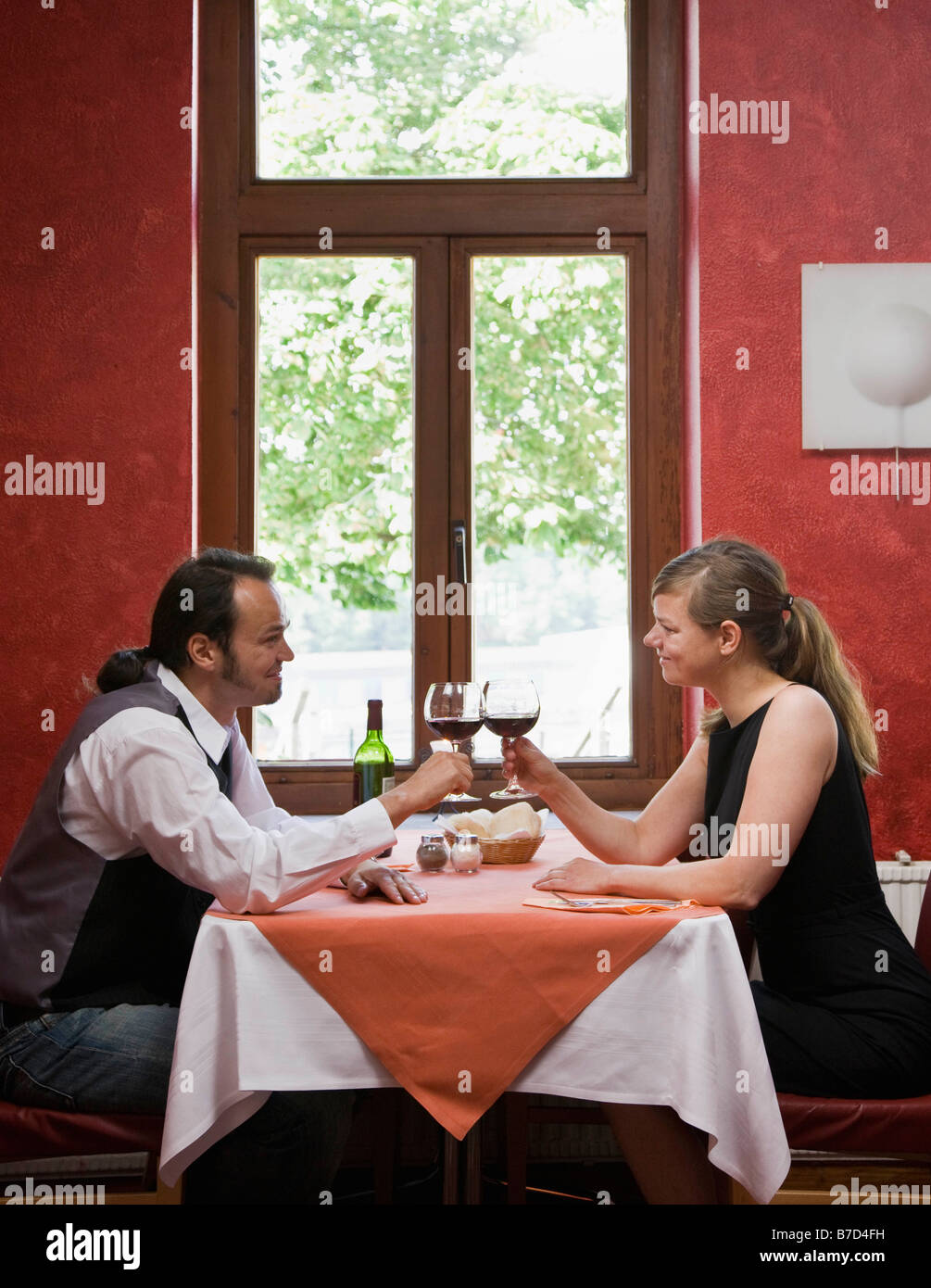 Man and woman having dinner together Stock Photo - Alamy