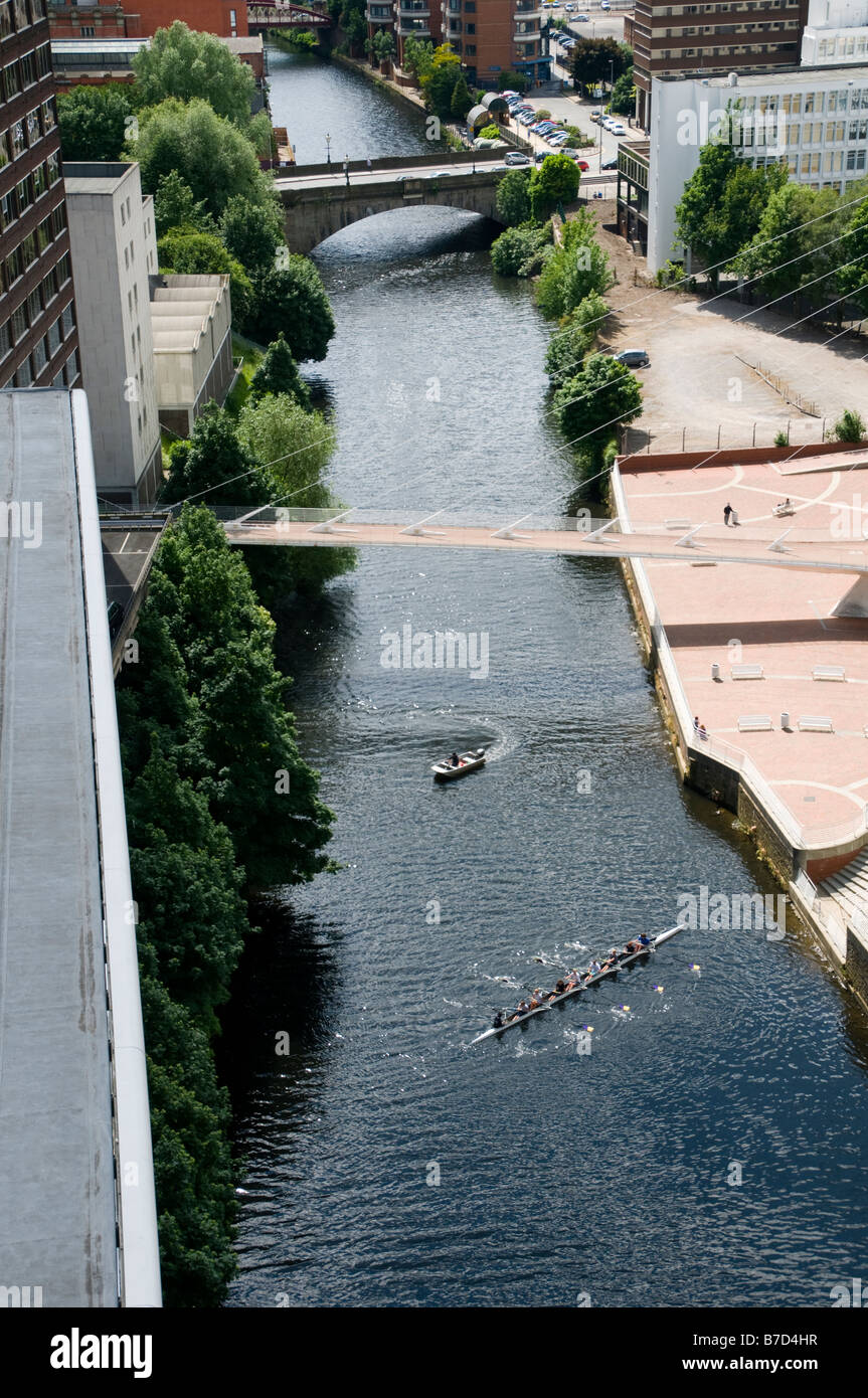Rowers on the river Irwell near the city centre of Manchester, England ...