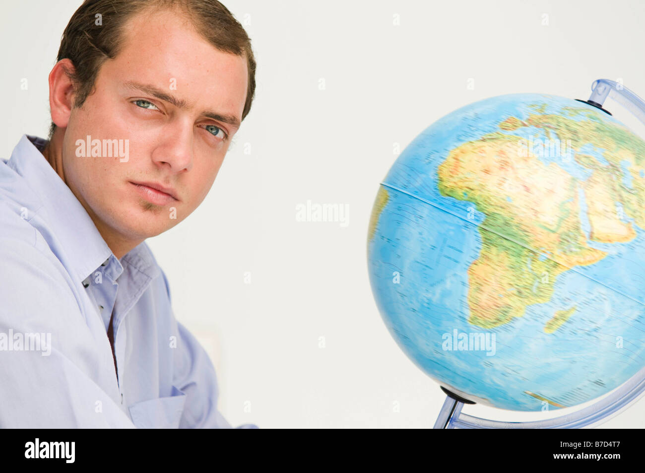 Portrait of a male and a globe Stock Photo - Alamy