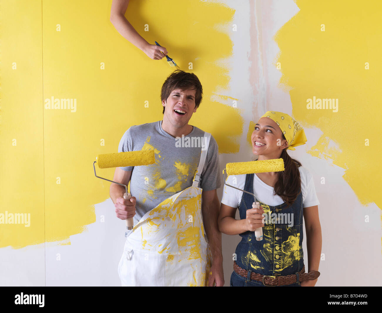Couple messing around with paint Stock Photo - Alamy