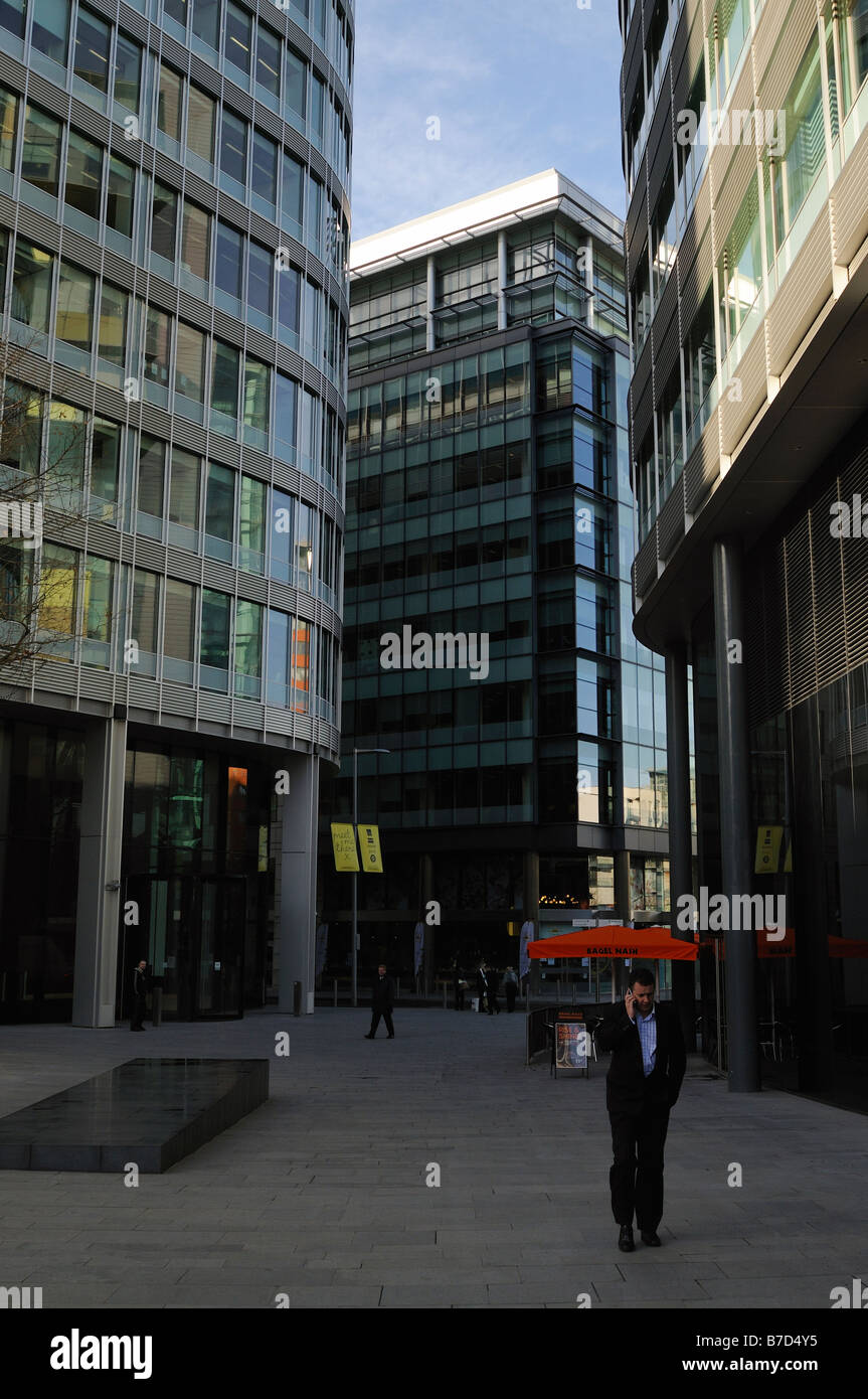 A man talking on a mobile phone in Manchester city center Stock Photo ...