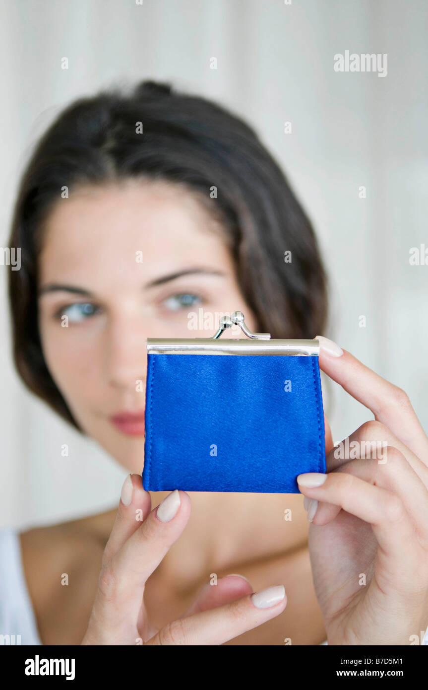A female looking at a purse Stock Photo - Alamy