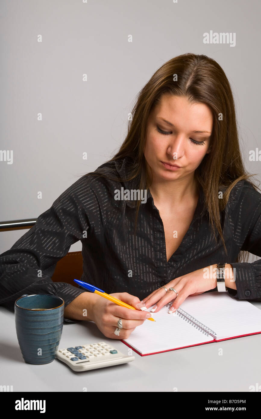 Woman sitting office desk hi-res stock photography and images - Alamy