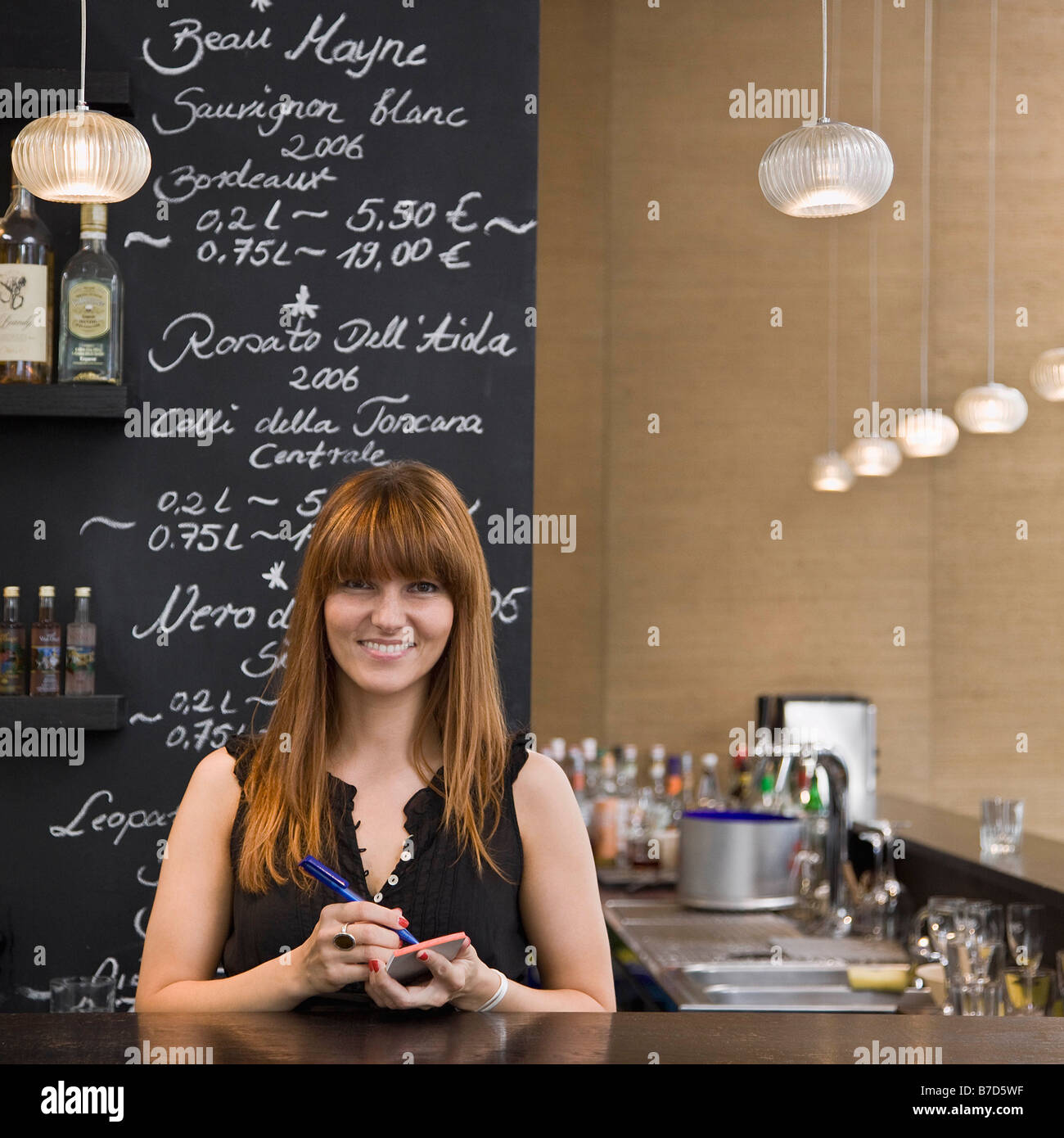 Waitress ready to take order Stock Photo - Alamy