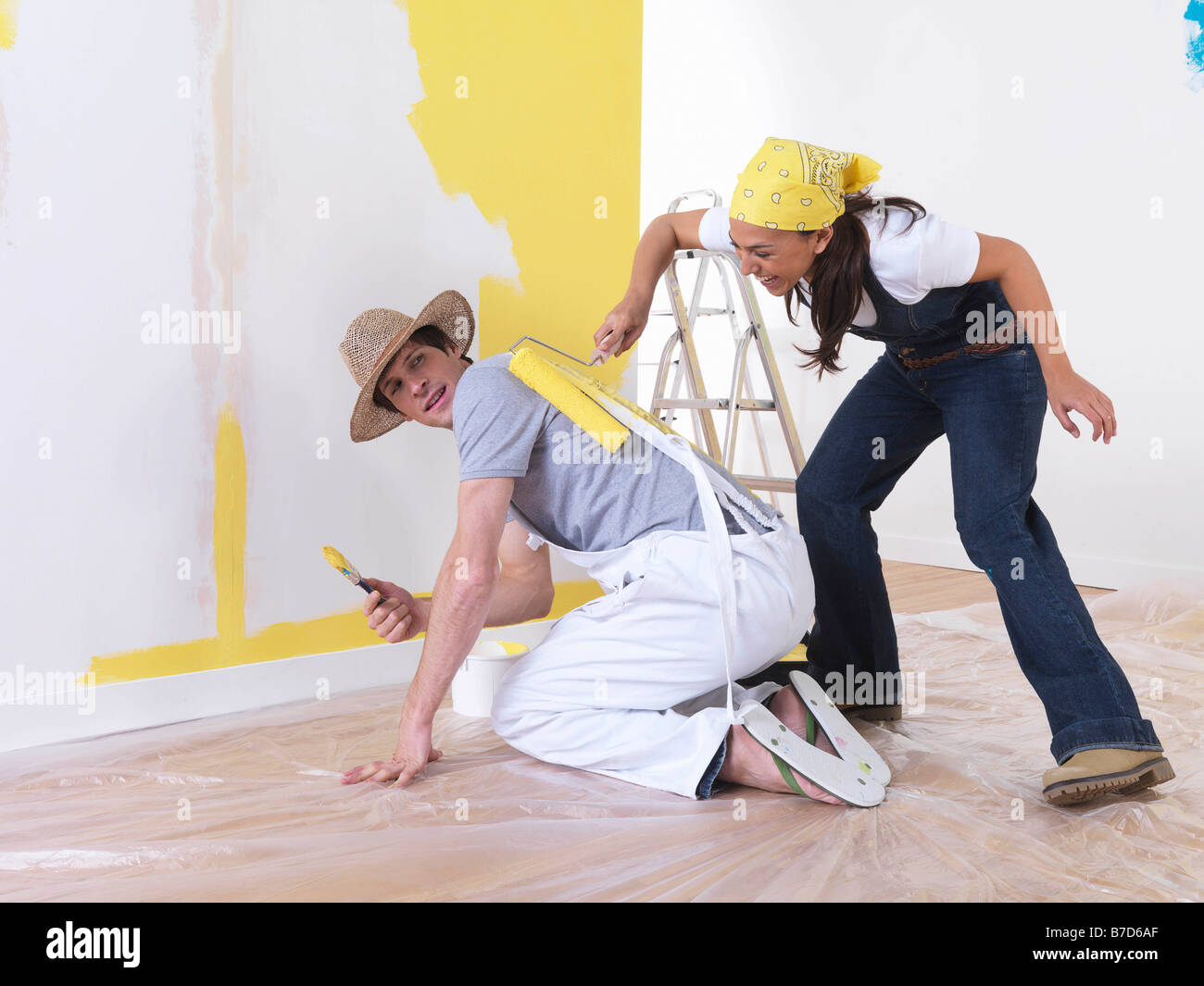 Couple messing around with paint Stock Photo - Alamy