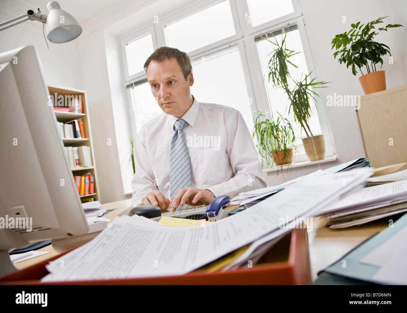Man working on computer Stock Photo - Alamy