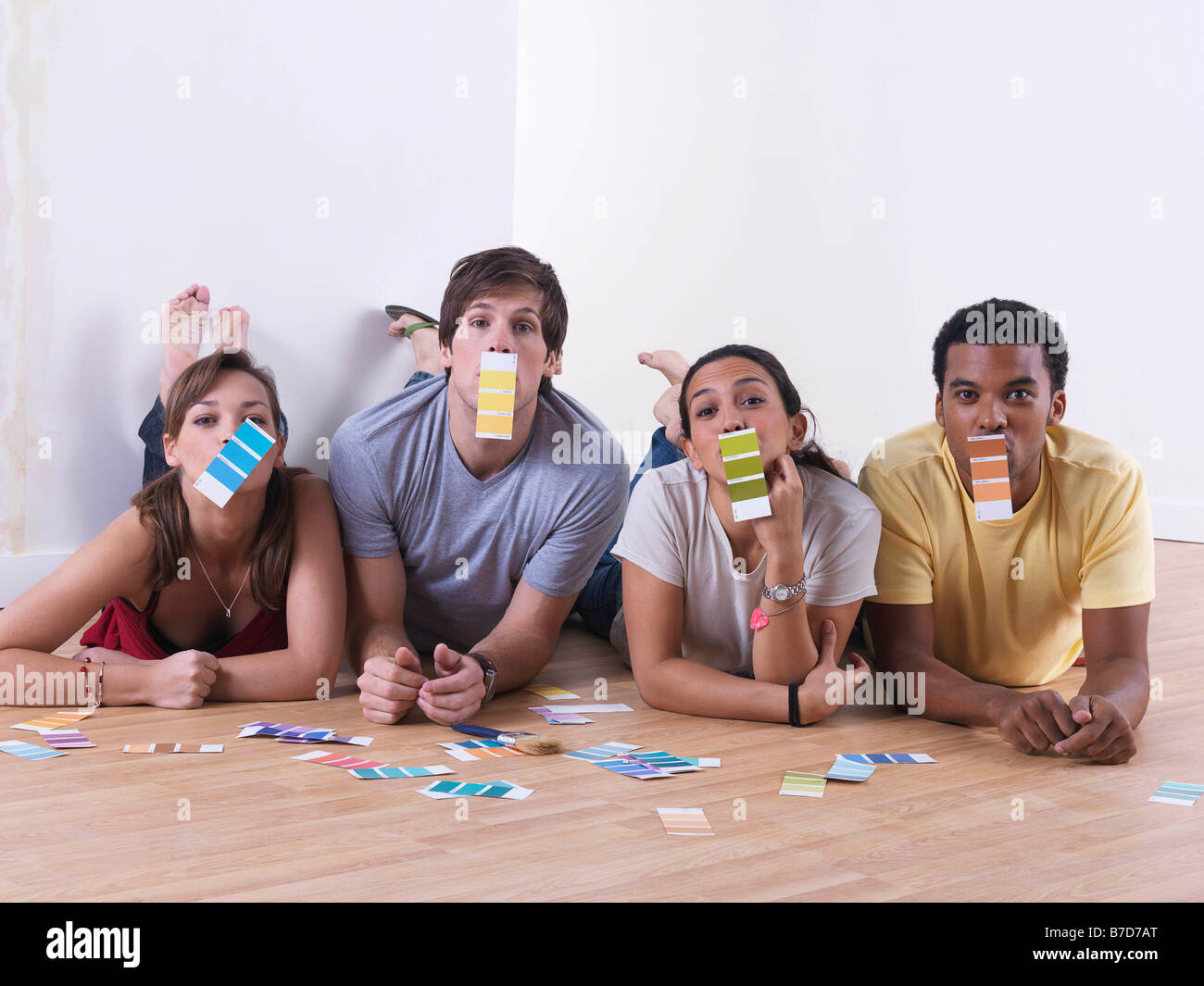Group of friends choosing paint colours Stock Photo - Alamy