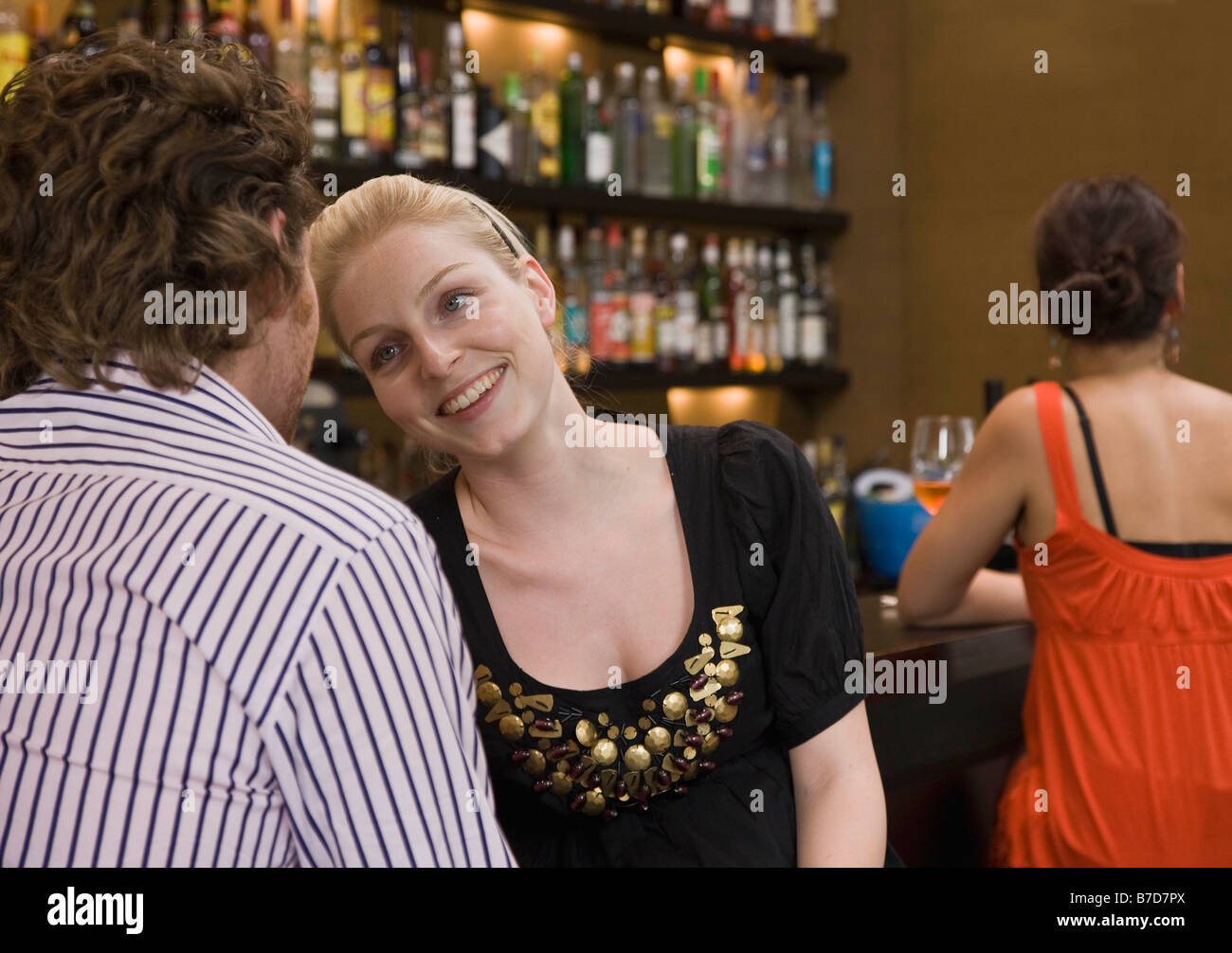 Sitting at bar rear view hi-res stock photography and images - Alamy