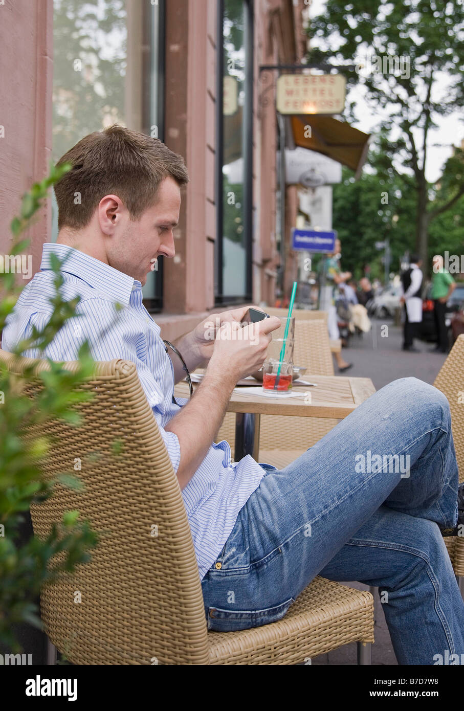 Young adult texting germany hi-res stock photography and images - Alamy