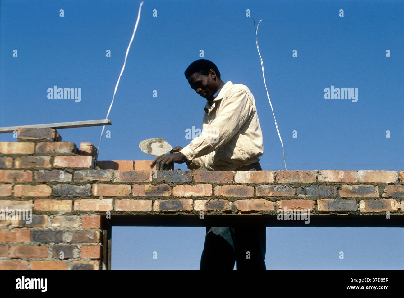Bricklaying house construction Stock Photo - Alamy