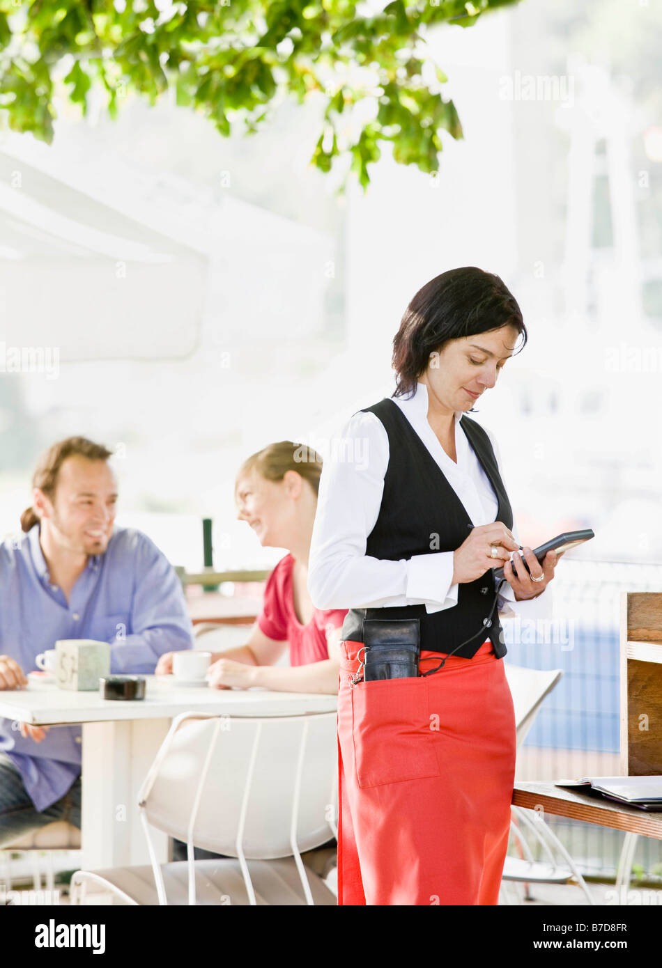 Female waitress taking orders Stock Photo - Alamy