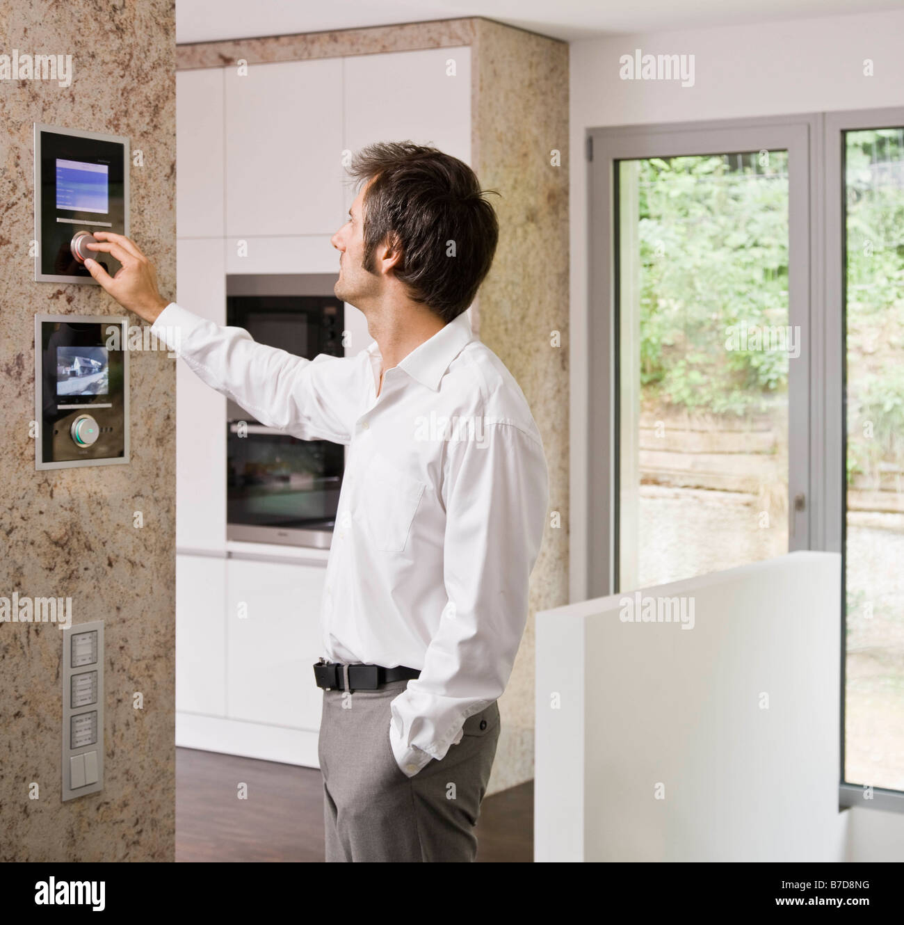 Man tuning the radio Stock Photo - Alamy