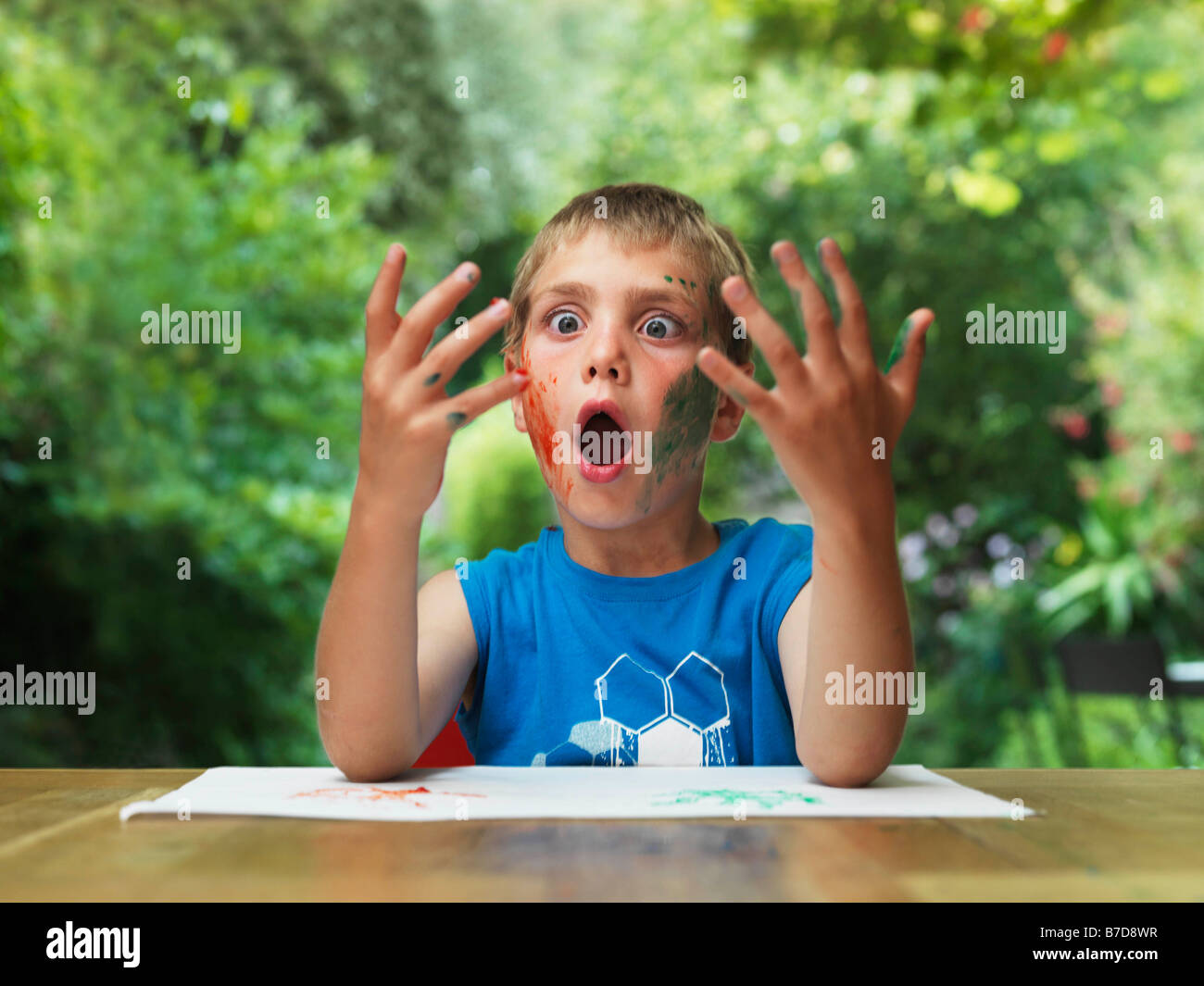 Boy paint on face, looking shocked Stock Photo - Alamy