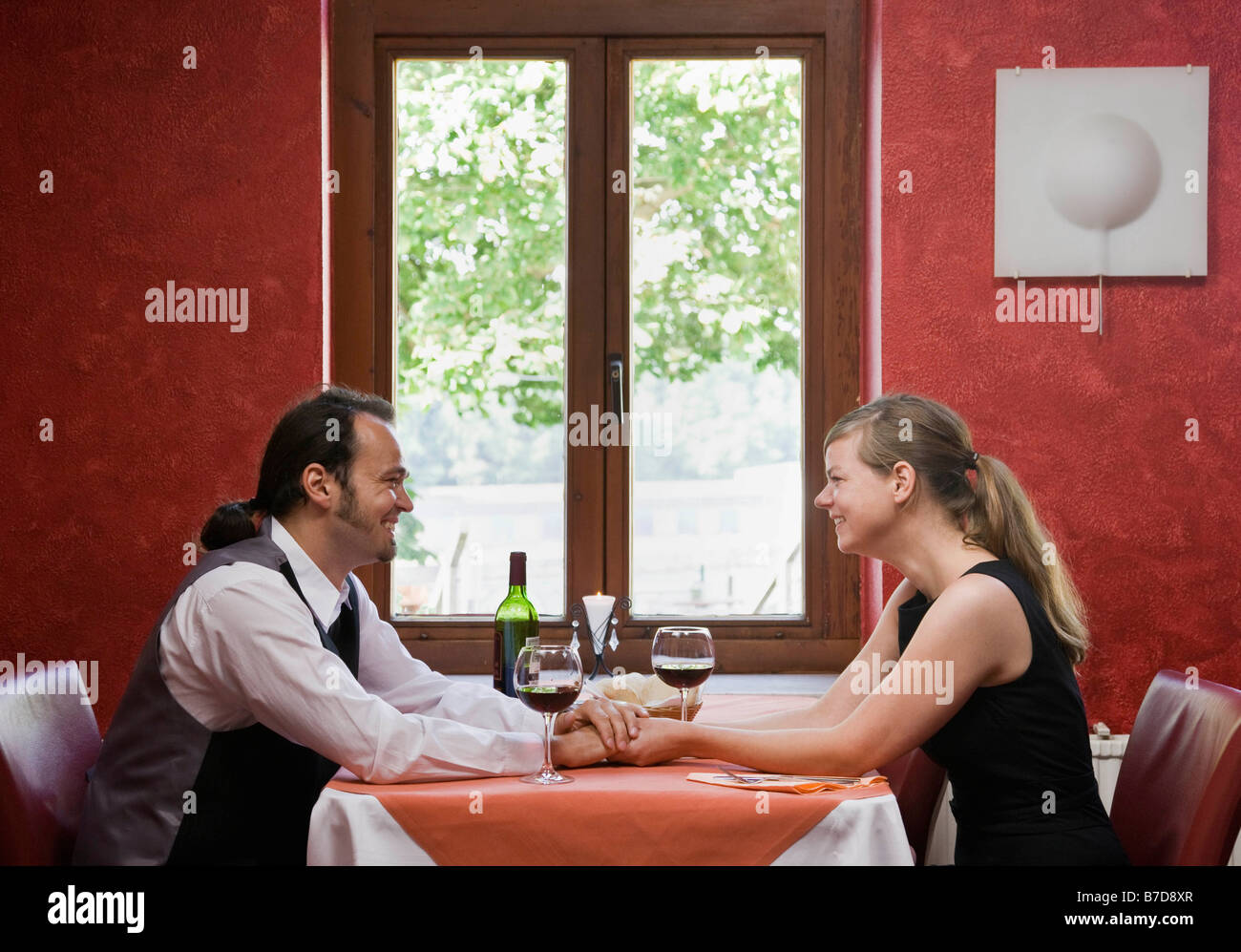 Man and woman having dinner together Stock Photo - Alamy