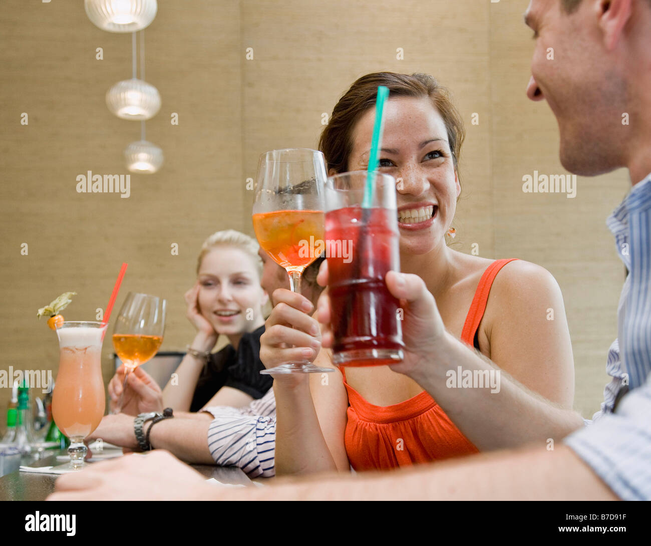 Friends drinking together Stock Photo - Alamy