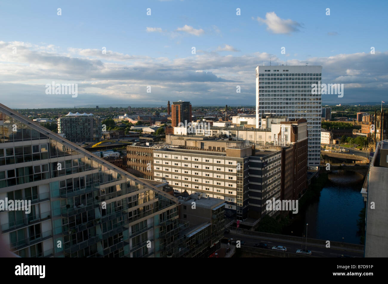 View over rooftops and the river Irwell from a city centre top floor ...