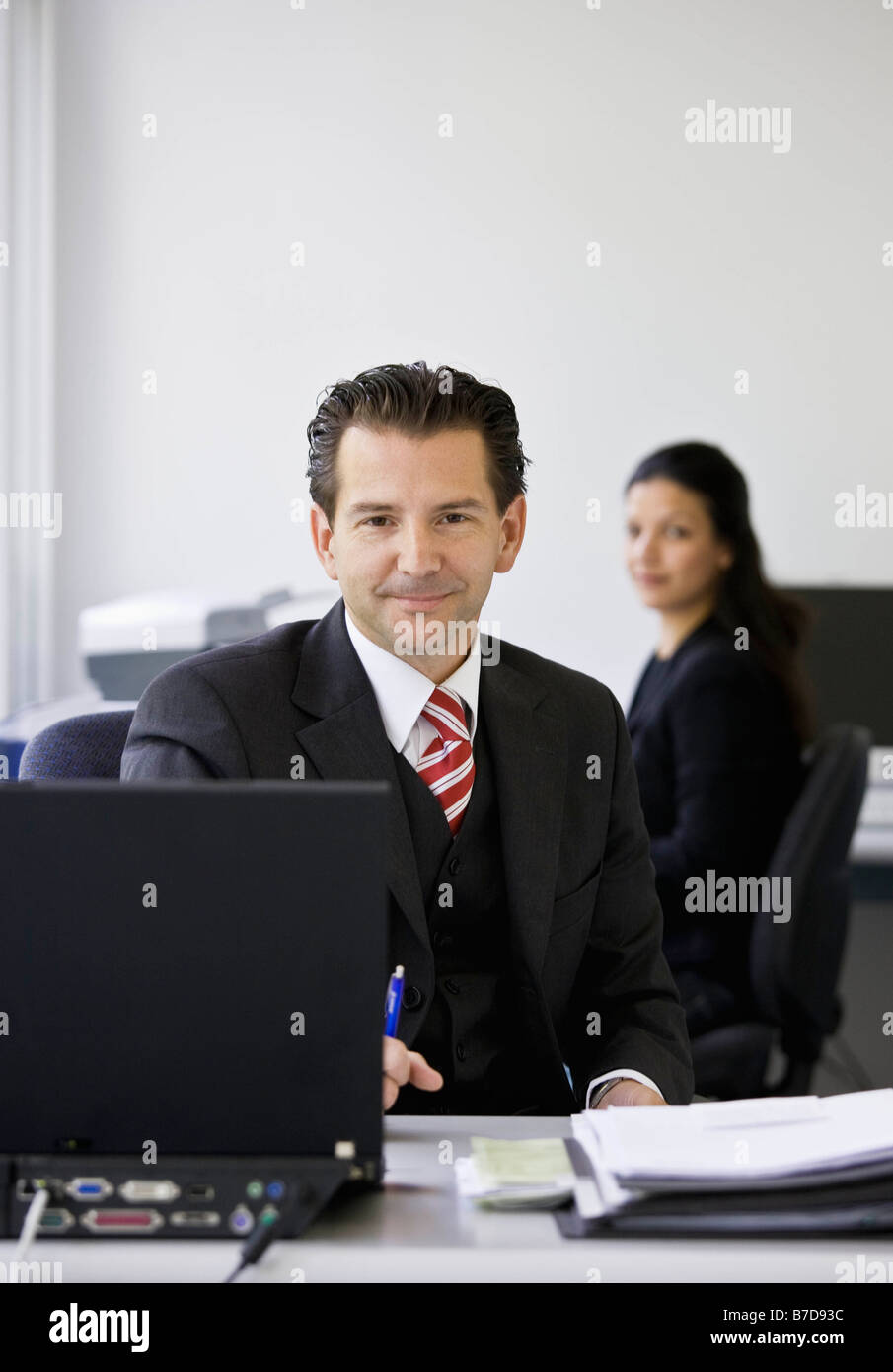 Portrait of workers in busy office Stock Photo - Alamy