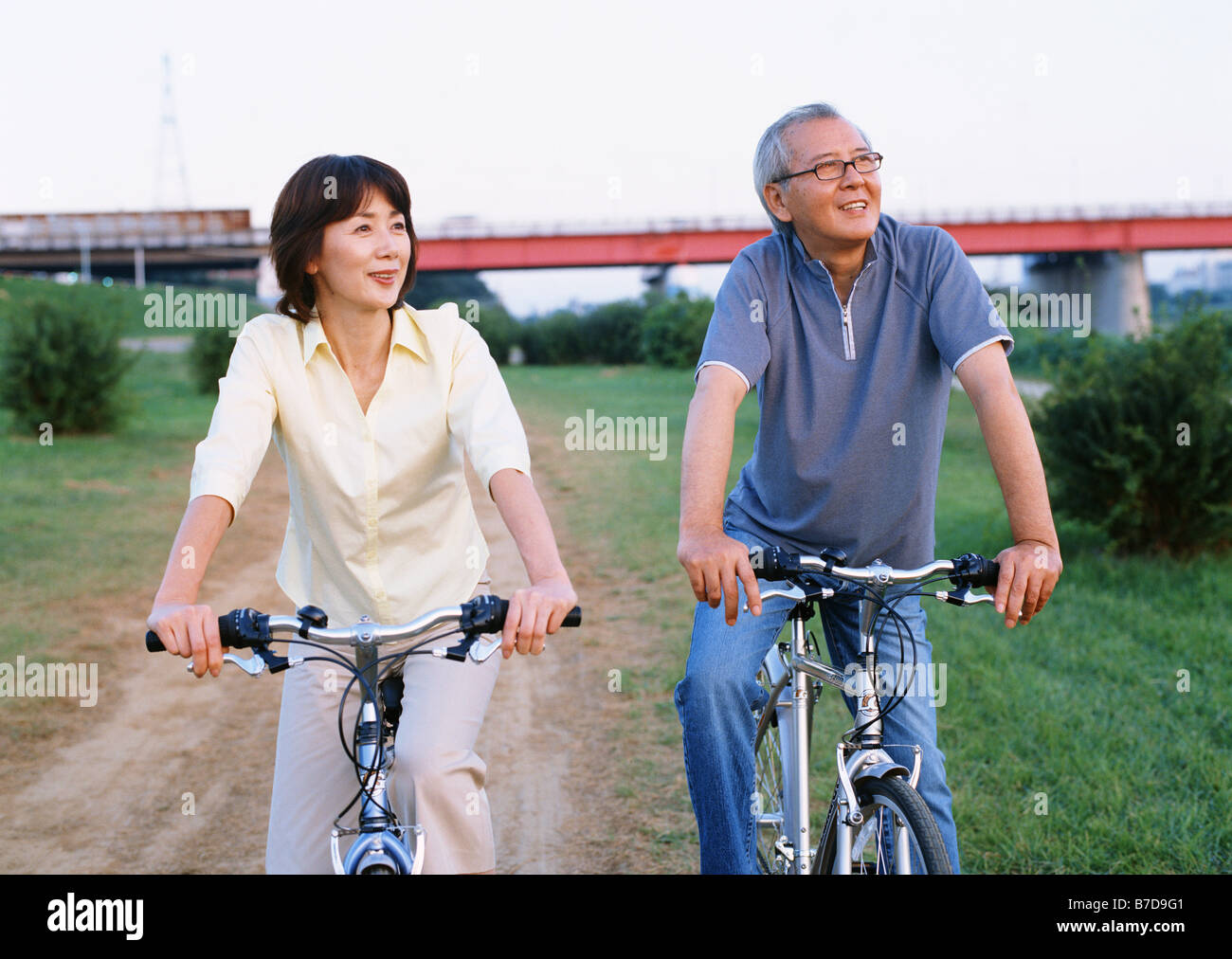 Asian elderly couple cycling hi-res stock photography and images - Alamy