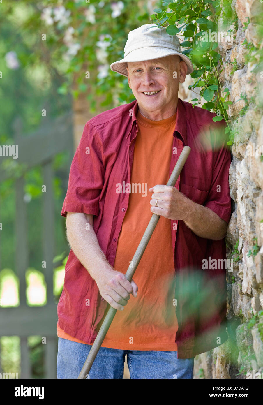 Portrait of a man gardening Stock Photo - Alamy