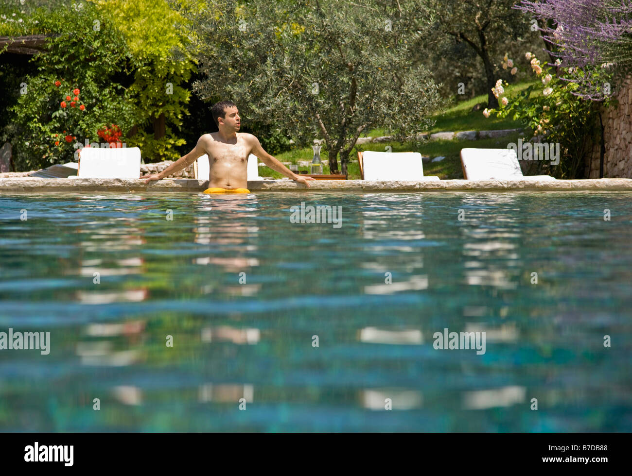 Man wading in the pool Stock Photo - Alamy