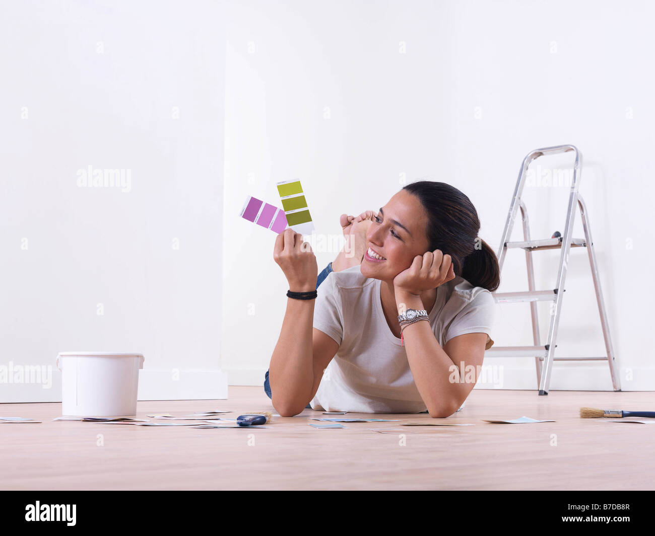 Girl choosing paint colours Stock Photo - Alamy