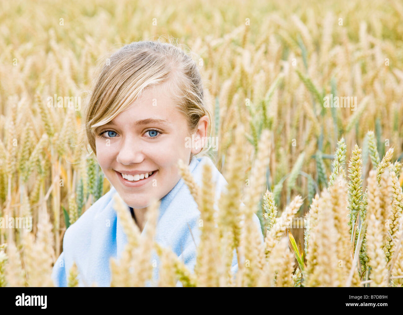 Portrait of a girl in a field Stock Photo - Alamy