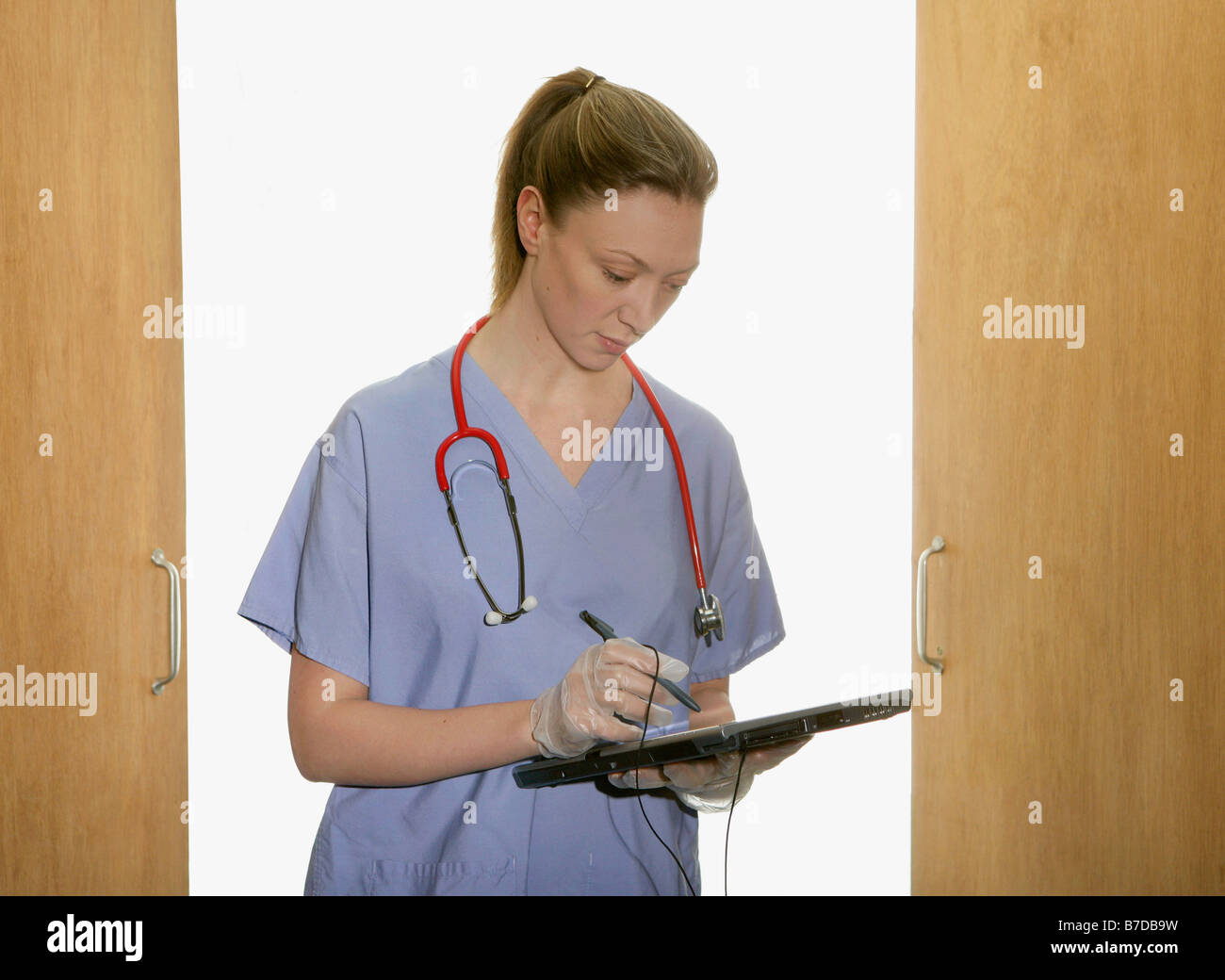 Female doctor using tablet pc Stock Photo - Alamy