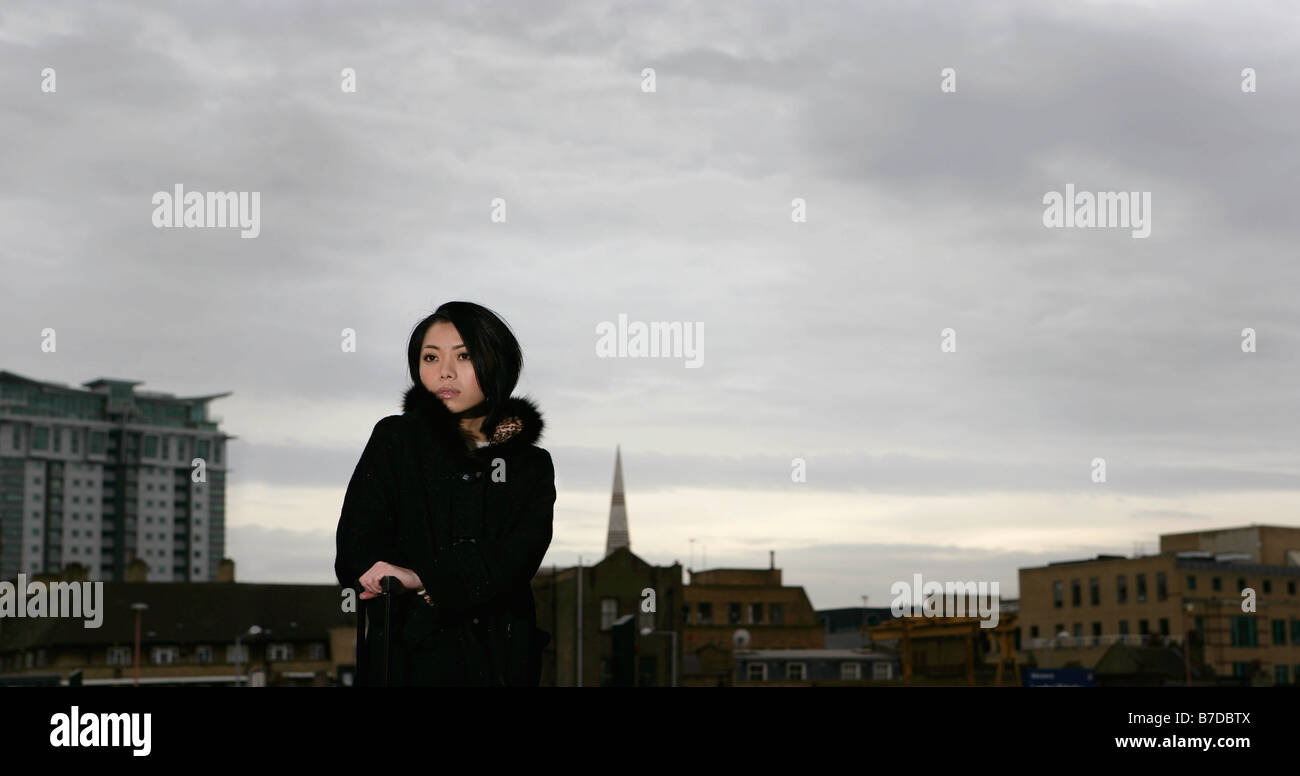 Woman on train platform Stock Photo - Alamy