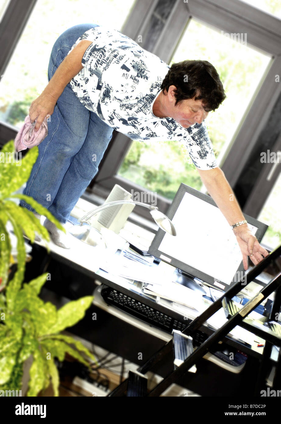 cleaning woman at risky cleaning Stock Photo - Alamy