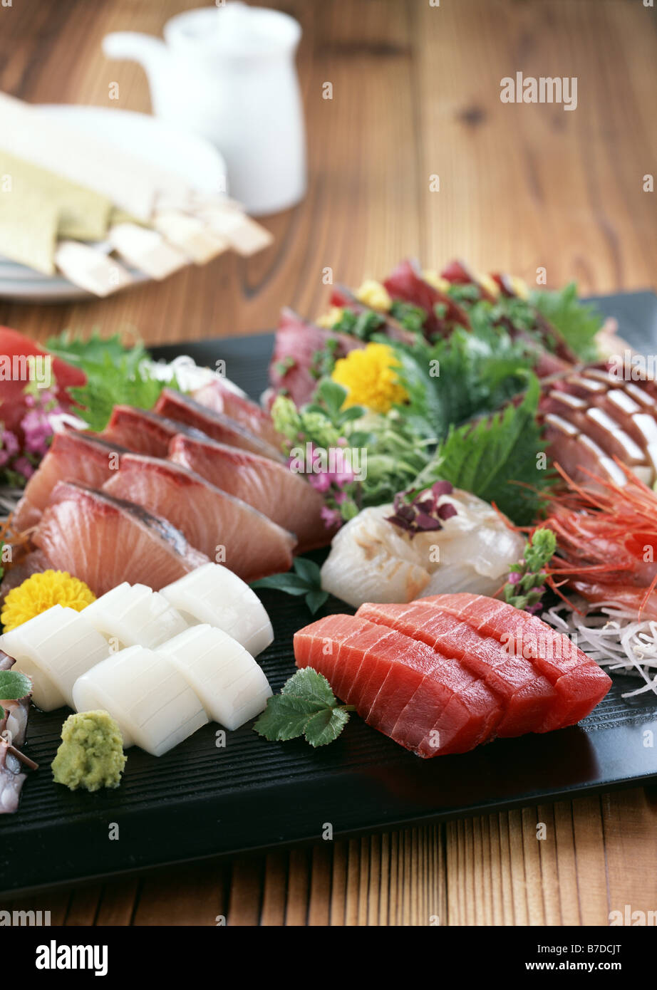 Japanese style assorted sashimi dish laid over crushed ice Stock Photo ...