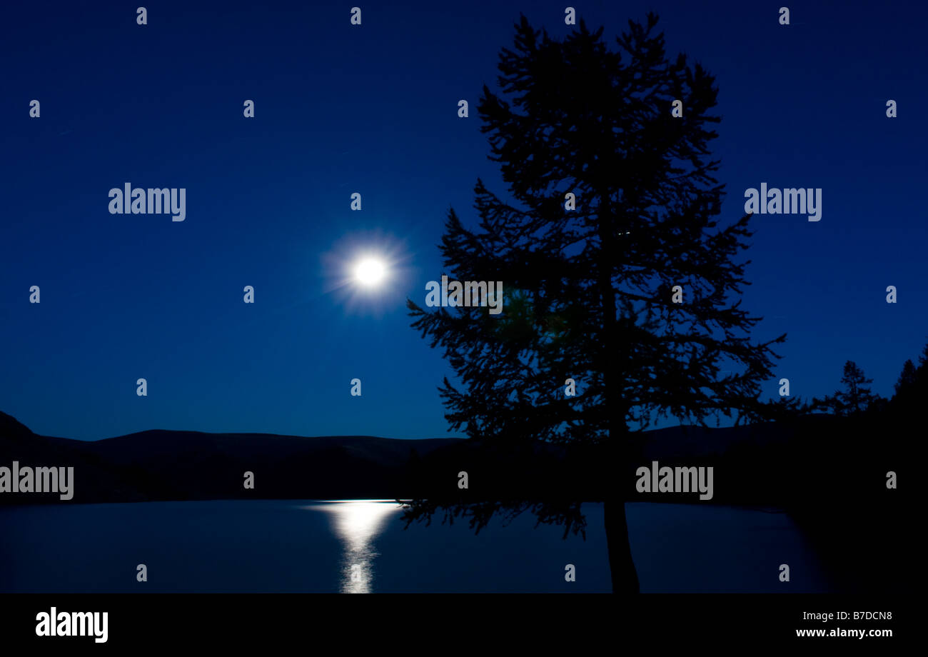 Moon shining over Shiret lake in the eight lake national park in ...